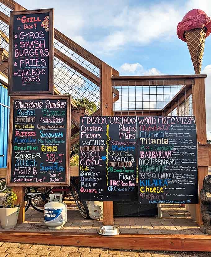 The colorful chalkboard menu reads like a treasure map for food lovers, with creative pizza names that promise delicious adventures.