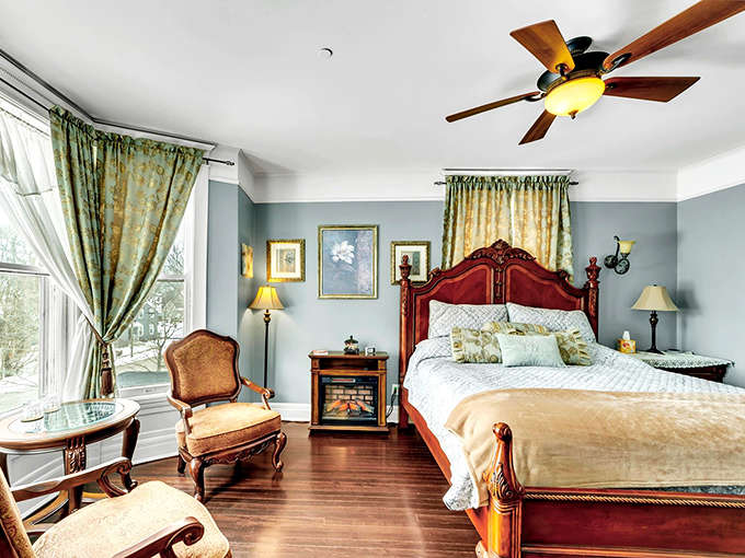 This guest room makes hotel chains look like they're not even trying, with period details that whisper "sleep well" in the most elegant way possible.