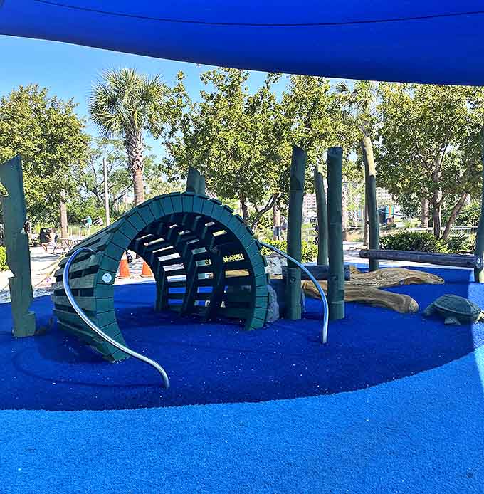 This tunnel isn't just a passage &ndash; it's a submarine adventure waiting to happen, complete with aquatic-colored lighting.