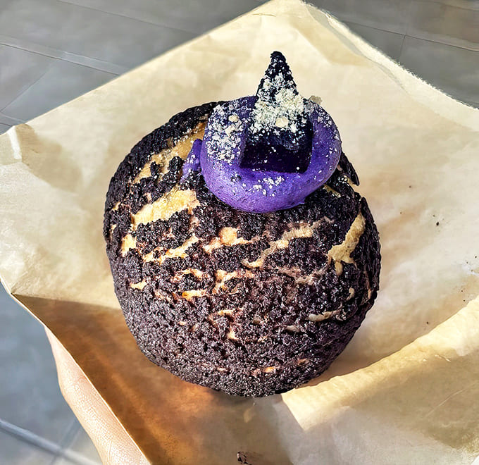 This isn't just any cream puff &ndash; it's a purple masterpiece that combines crispy choux pastry with velvety ube cream.