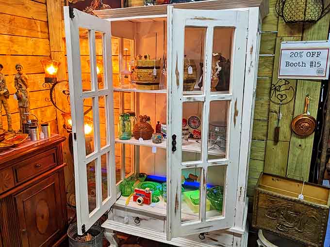 This isn't just furniture &ndash; it's a stage where delicate treasures perform behind glass, waiting for their next starring role in someone's home.