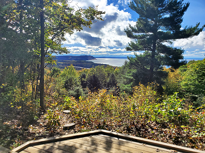 Nature's infinity pool! This breathtaking vista showcases Michigan's answer to the question: "What if we combined mountains, beaches, and postcard-perfect skies?"
