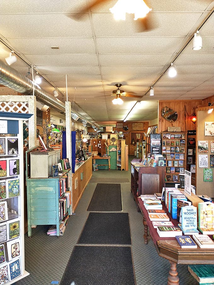Wooden shelves create cozy pathways through the store, inviting exploration and promising literary discoveries around every corner.