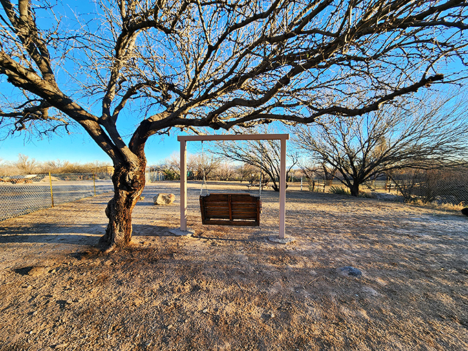 Nothing says "vacation mode activated" like swinging gently in this wooden porch swing while mountain views unfold before your eyes.