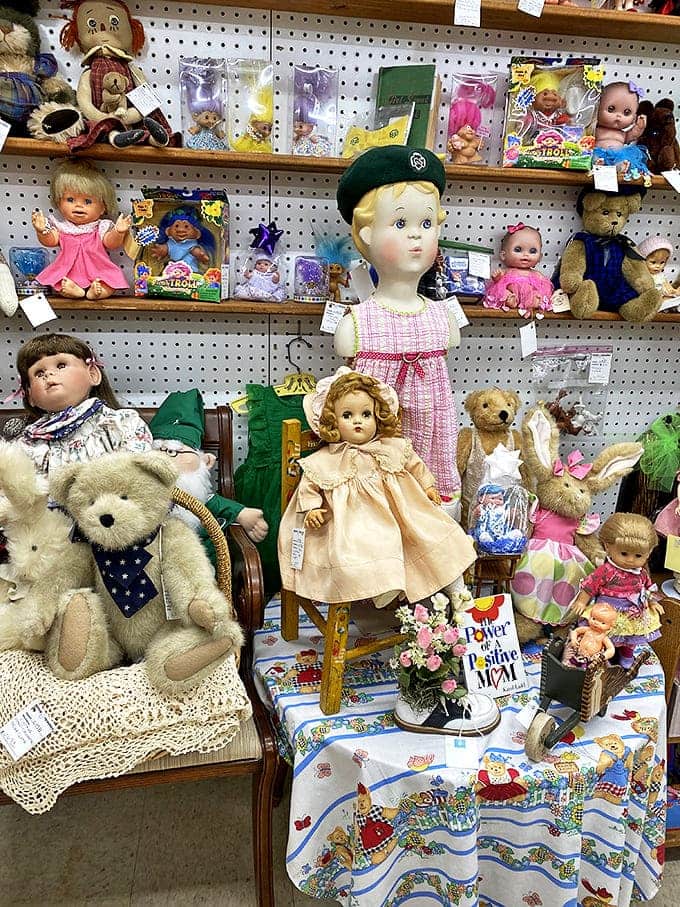 Vintage dolls stare with timeless expressions, their porcelain faces and fabric bodies telling silent stories of the children who once loved them.