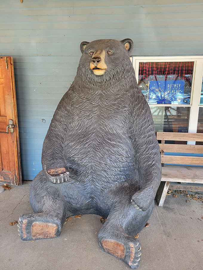This stoic bear statue greets visitors with a permanent poker face, silently judging your antique-buying decisions.