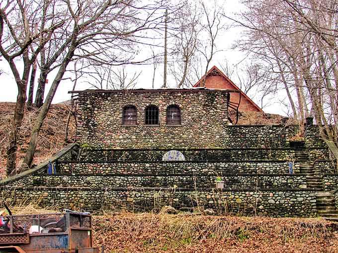 This stone fortress-like structure stands as a testament to Houghton's architectural heritage, weathered yet dignified against the changing seasons.