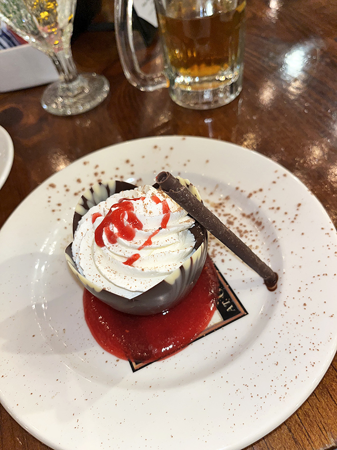 This chocolate mousse isn't just dessert&mdash;it's a silky revelation topped with fresh whipped cream and a chocolate garnish that makes spoons move faster.