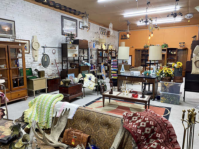 Each room flows into another unexpected space, this one with warm orange walls showcasing furniture arrangements that feel like stepping into someone's vintage living room.