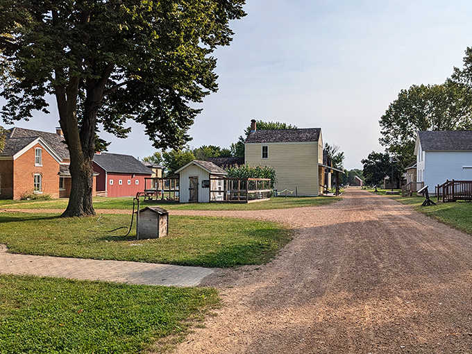Stone cottages and wooden structures create a village frozen in time, where modern worries seem to dissolve into the Minnesota air.