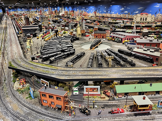 Behold the breathtaking main attraction: a miniature metropolis where trains weave through skyscrapers and neighborhoods with perfect precision.