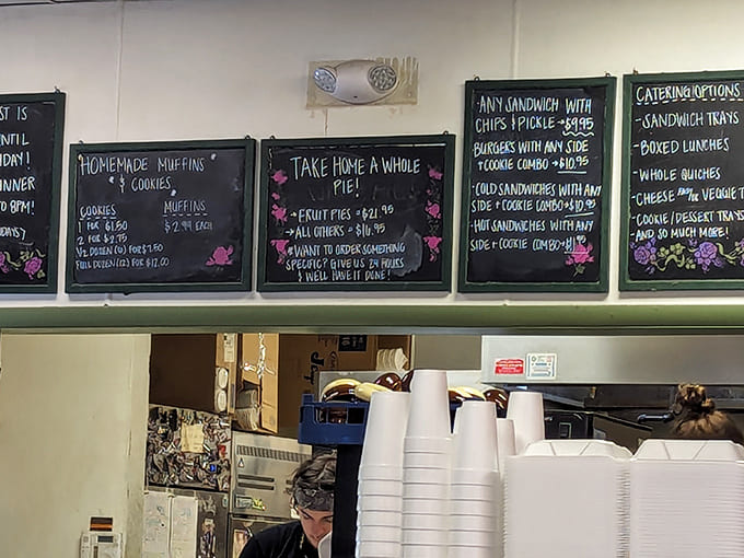 The chalkboard menu tempts with homemade delights – from sandwiches to whole pies, each offering scrawled with the same care that goes into making them.