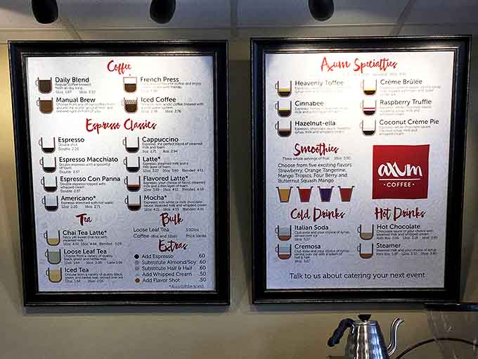The menu board tempts with everything from classic espresso to "Awww Specialties" – because cat cafés understand the importance of both caffeine and cuteness.