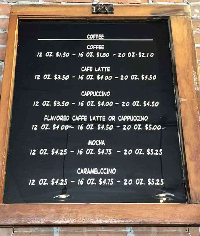 A rustic wooden menu board displays a variety of refreshing beverages available for anyone visiting this cozy Ohio coffee shop.