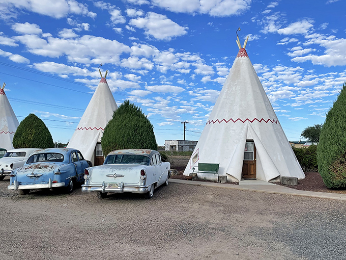 A village of white teepees stands at attention, their distinctive silhouettes creating the roadside mirage that's stopped travelers since the 1950s.