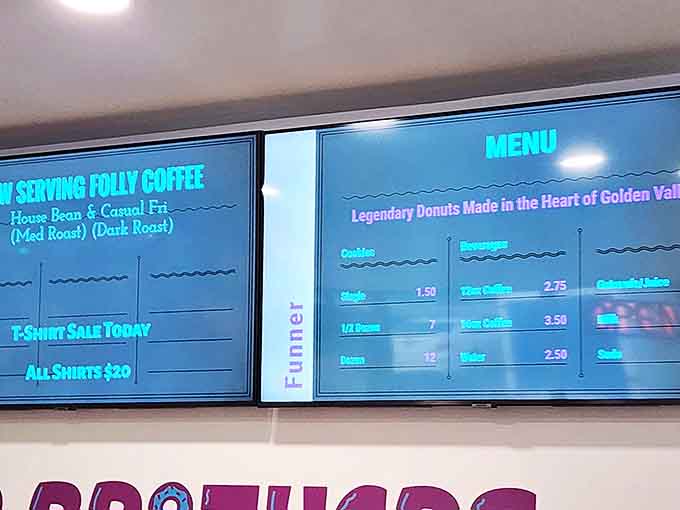 The glowing menu board reveals a treasure map of sweetness, with Folly Coffee providing the perfect companion to your sugary adventure.