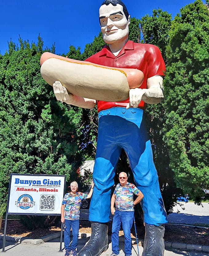 Visitors pose beneath the towering fiberglass figure, creating memories that will outlast any souvenir t-shirt.