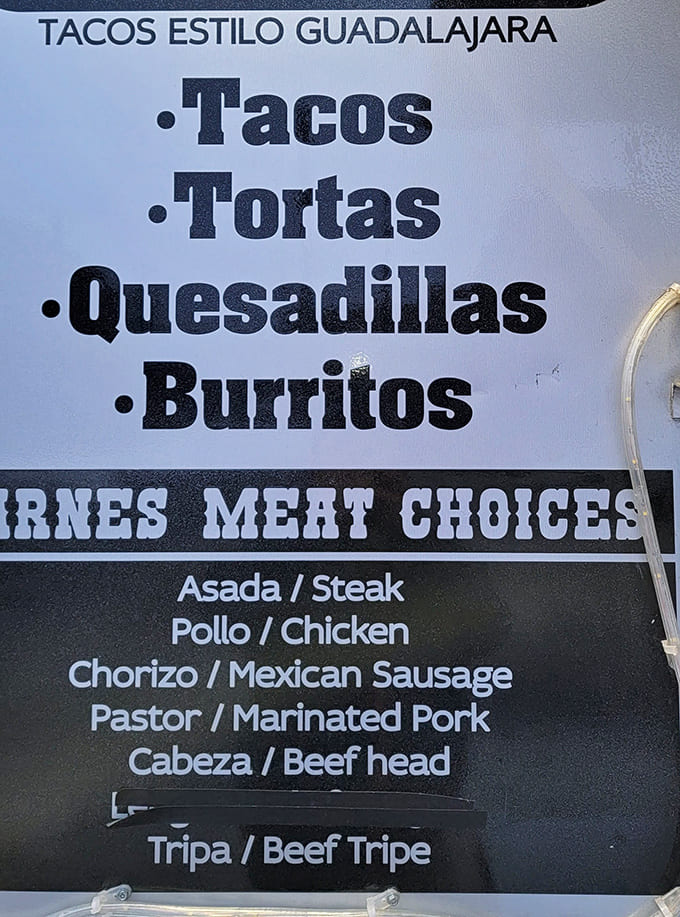 Decision time at Tacos El Loco: The menu board showcases authentic options from asada to tripa, with no fancy frills needed.