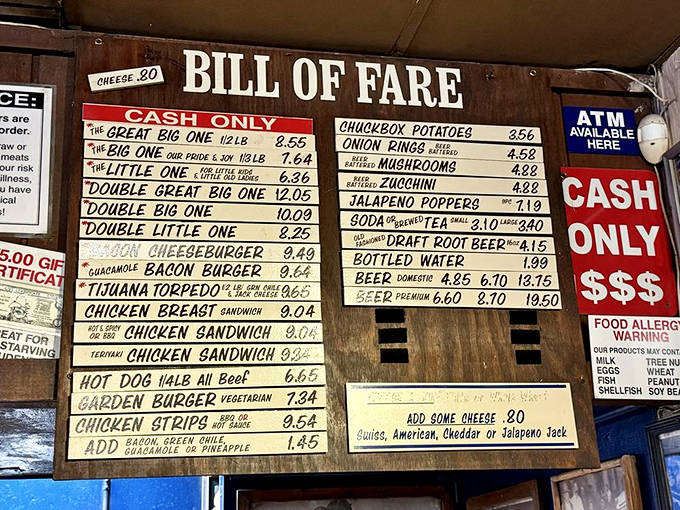 The hand-painted menu board offers straightforward burger perfection. Cash only, folks &ndash; some traditions are worth preserving.