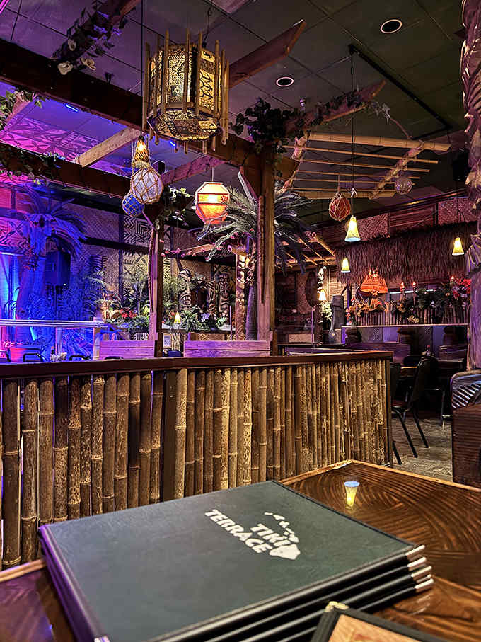Exotic tiki statues, bamboo walls, and island-inspired lighting create the perfect escape at The Tiki Terrace, where Hawaii meets the Midwest.
