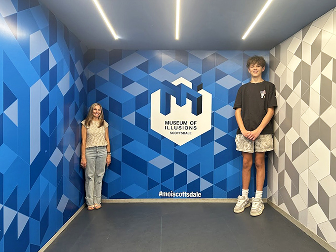 Size becomes relative in the famous Ames Room, where friends can appear giant or tiny depending on where they stand.