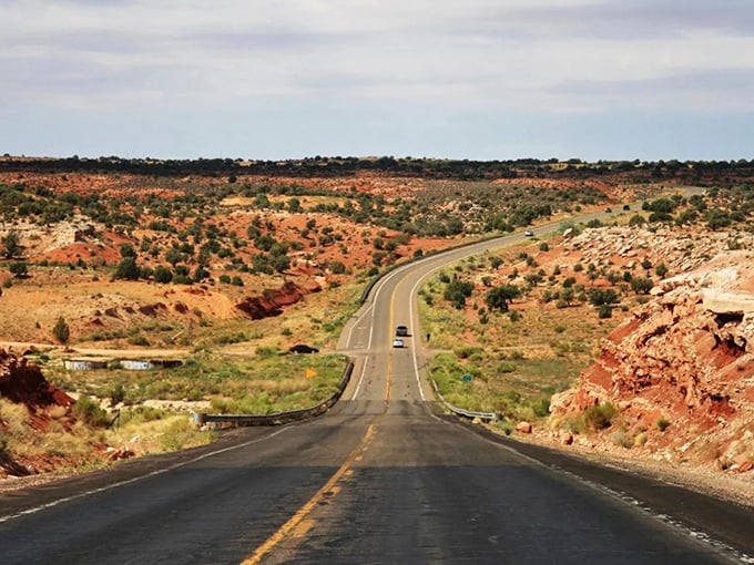 Cars navigate the curves of SR-98, dwarfed by the vast landscape that reminds us how wonderfully small we are.