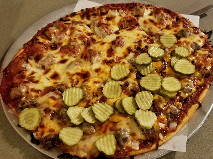 Behold the star attraction: a Bacon Cheeseburger Pizza with perfectly distributed toppings that somehow improves on both pizza and burgers.