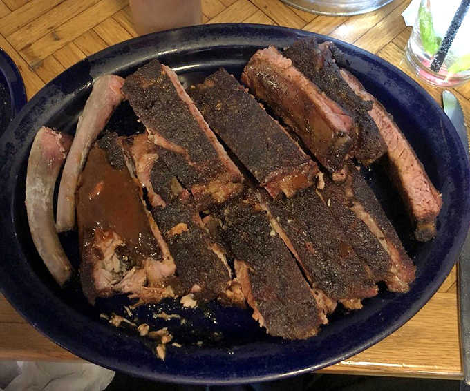 These aren't just ribs; they're meat masterpieces with a perfect smoke ring that practically whispers "Take a bite!"