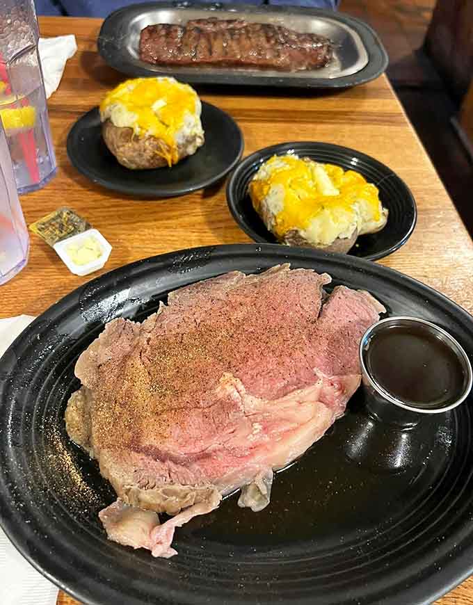 Prime rib perfection on a plate, with that ideal crust and rosy center that makes carnivores weep with joy.