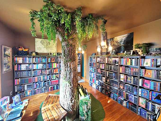 That handcrafted tree creates a fantasy forest canopy where hobbits, wizards, and dragons coexist peacefully on surrounding shelves.