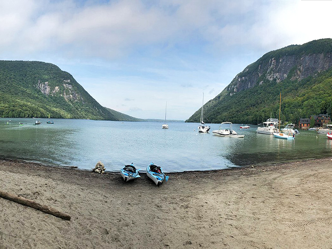 Sailboats dot the pristine surface, dwarfed by towering cliffs that remind you just how wonderfully small we are in nature's grand design.