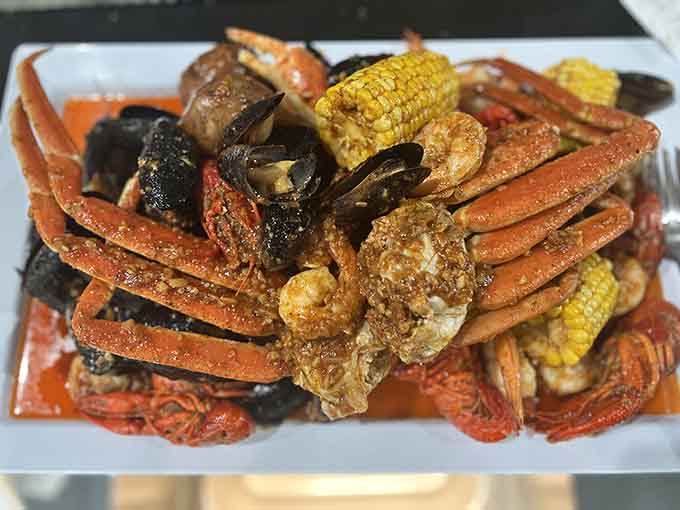 Snow crab legs arrive looking like edible treasure, glistening with seasoned butter and ready for cracking.