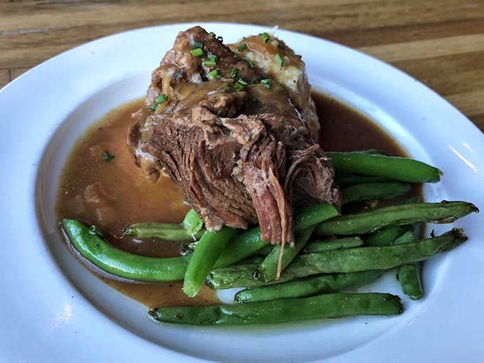 Fall-apart tender braised short ribs swimming in rich, stout-infused gravy &ndash; a dish worth crossing state lines for.