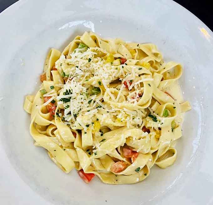 Classic fettuccine tossed with vegetables and cheese, proving simplicity can be absolutely spectacular when done right.