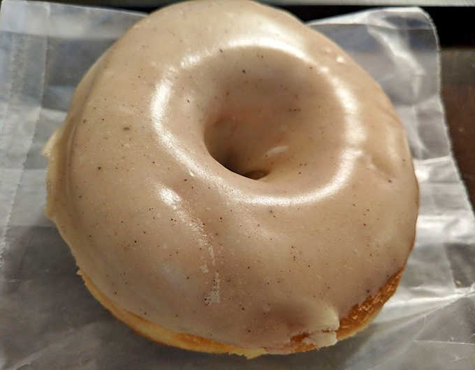 The legendary brown butter donut in all its glory—that glossy, caramelized glaze hiding a pillowy interior that's worth every calorie.