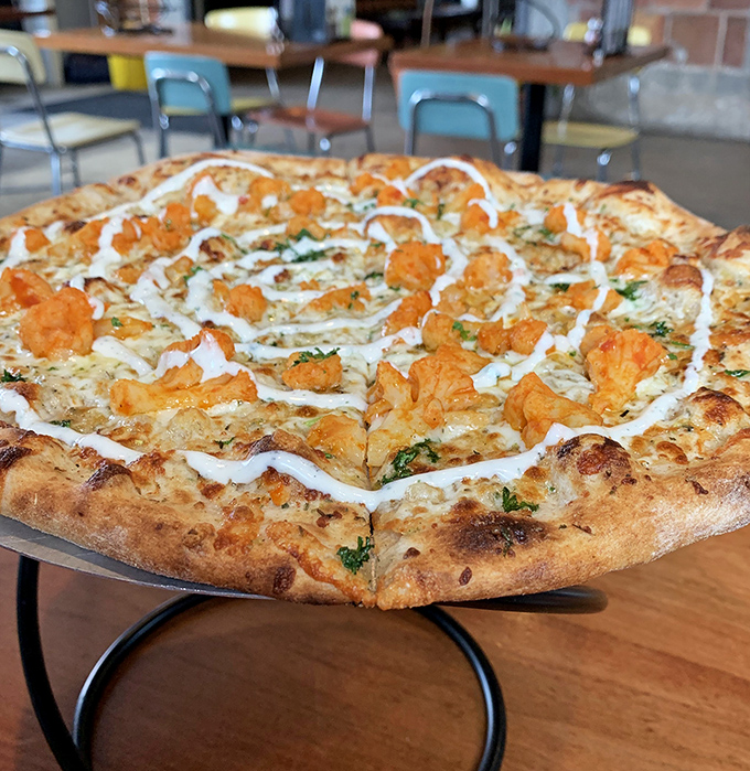 Buffalo chicken pizza &ndash; where vegetarian dreams come true with spicy florets and cooling ranch swirls.