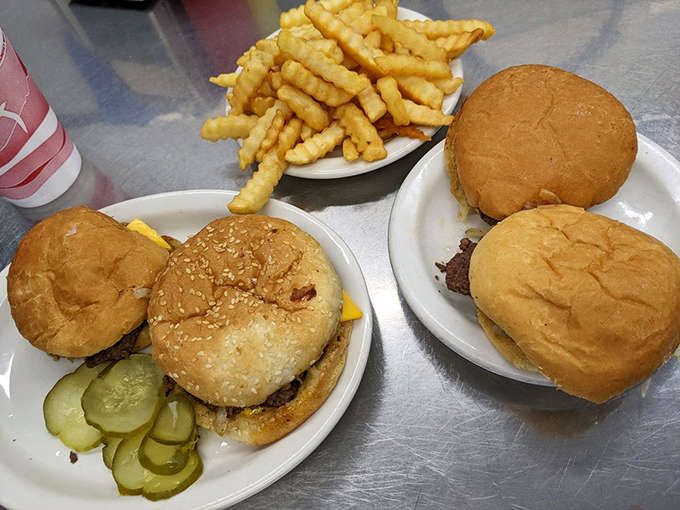 These aren't just burgers, they're edible nostalgia &ndash; perfectly proportioned sliders with house-made pickles that snap with each bite.