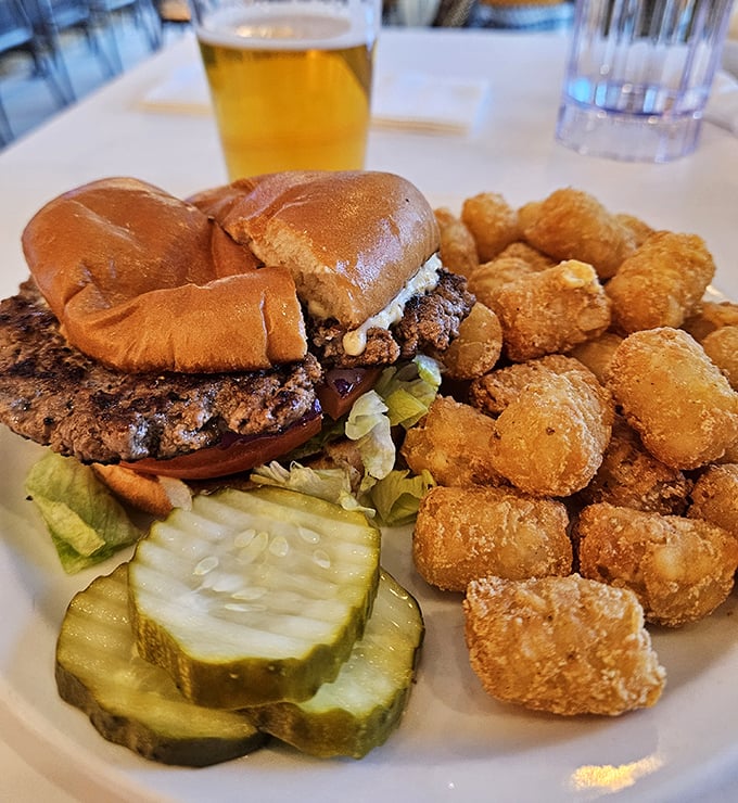 A burger and tots platter that makes you question whether you've ever truly experienced comfort food before this moment.