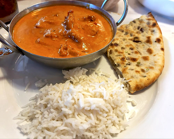 This menu isn't just reading material &ndash; it's your passport to flavor country, with both familiar favorites and delicious mysteries awaiting. Photo credit: <a href="https://maps.google.com/maps/contrib/104931591620189941918" target="_blank" rel="noopener noreferrer">Namaste Grill</a>