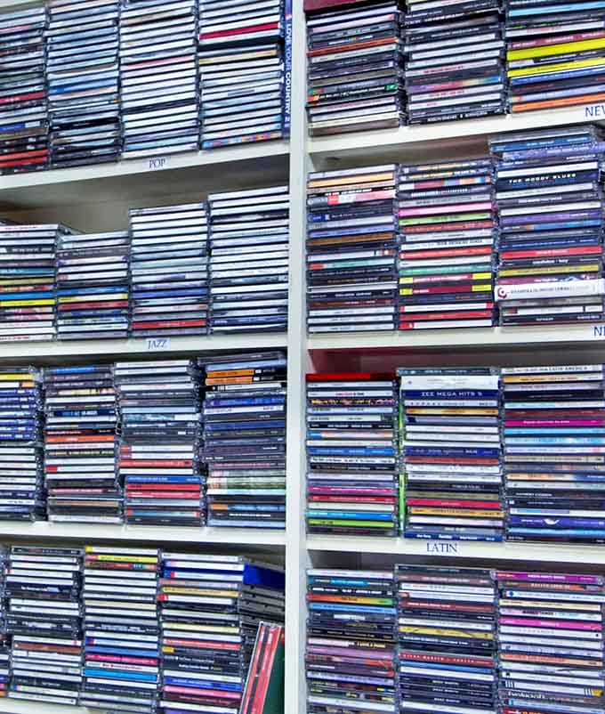 The CD collection spans decades and genres, a shiny reminder of when music came in jewel cases we swore not to scratch.