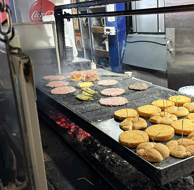 Burger alchemy happens here. That mesquite charcoal isn't just for show &ndash; it's the secret behind that distinctive smoky flavor you can't replicate at home.