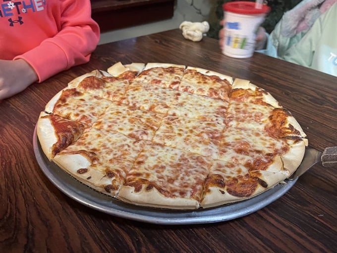 Cheese perfection in its purest form: A classic cheese pizza that proves simplicity, when done right, is anything but boring.