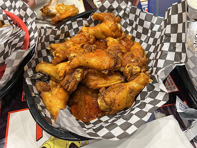 These wings aren't just appetizers &ndash; they're flavor vehicles delivering saucy satisfaction with each bite, served in classic checkered paper for maximum nostalgia.