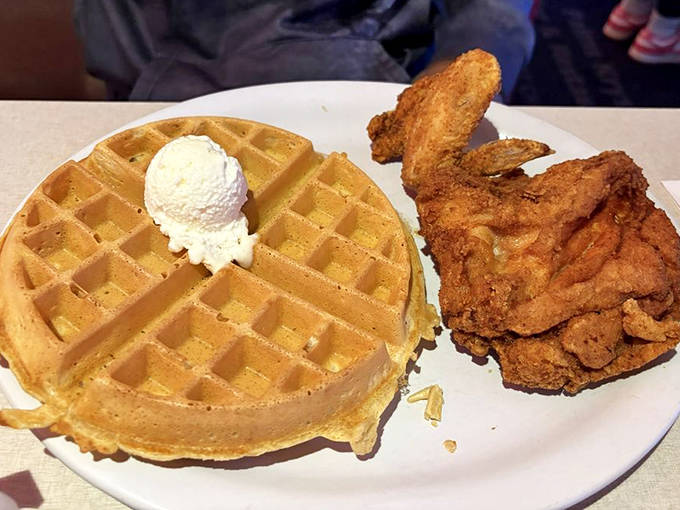 The chicken and waffles arrive like old friends who've finally found each other after years apart – a reunion worth celebrating with extra syrup.