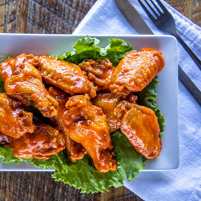 These aren't just wings, they're flavor vehicles! Crispy outside, juicy inside, and sauced to perfection &ndash; wing nirvana achieved.