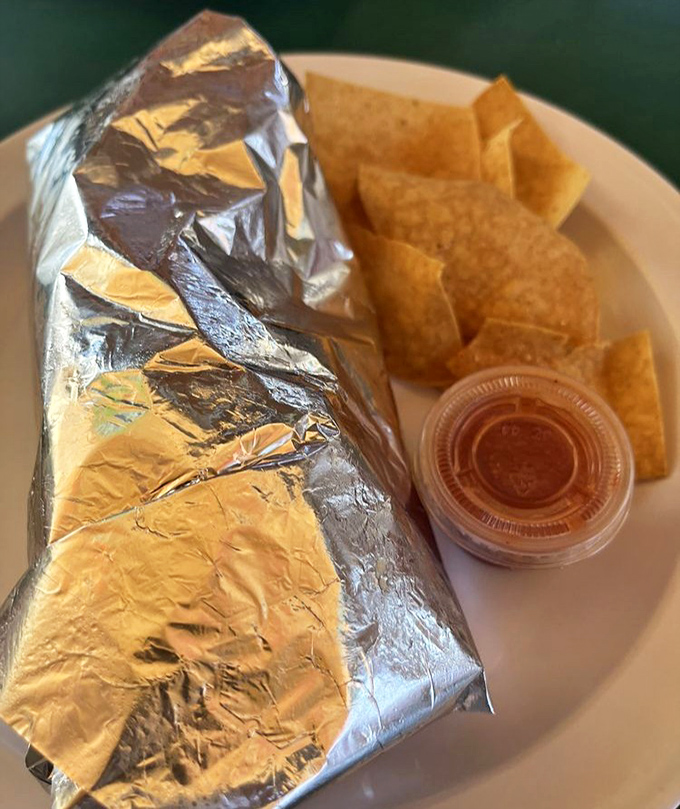 That foil-wrapped package might look humble, but unwrap it to discover a Chile Relleno Burrito that's practically a religious experience with chips.