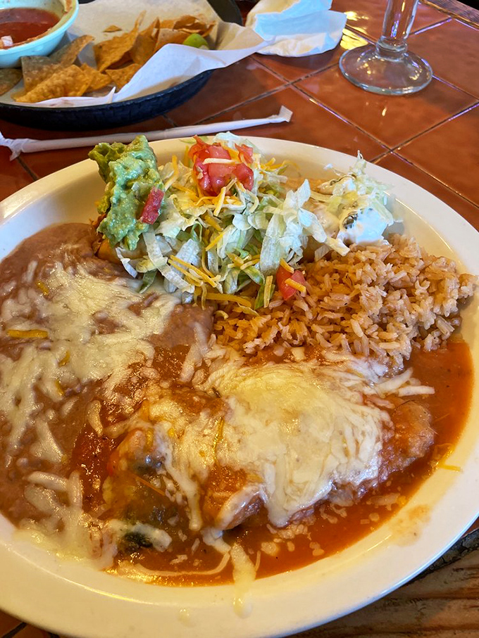 Chile Rellenos that dreams are made of &ndash; a perfectly roasted poblano stuffed with melty cheese, surrounded by that heavenly sauce.