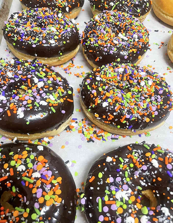 Chocolate donuts wearing their party clothes! These sprinkle-topped beauties are like edible confetti celebrations waiting to happen.