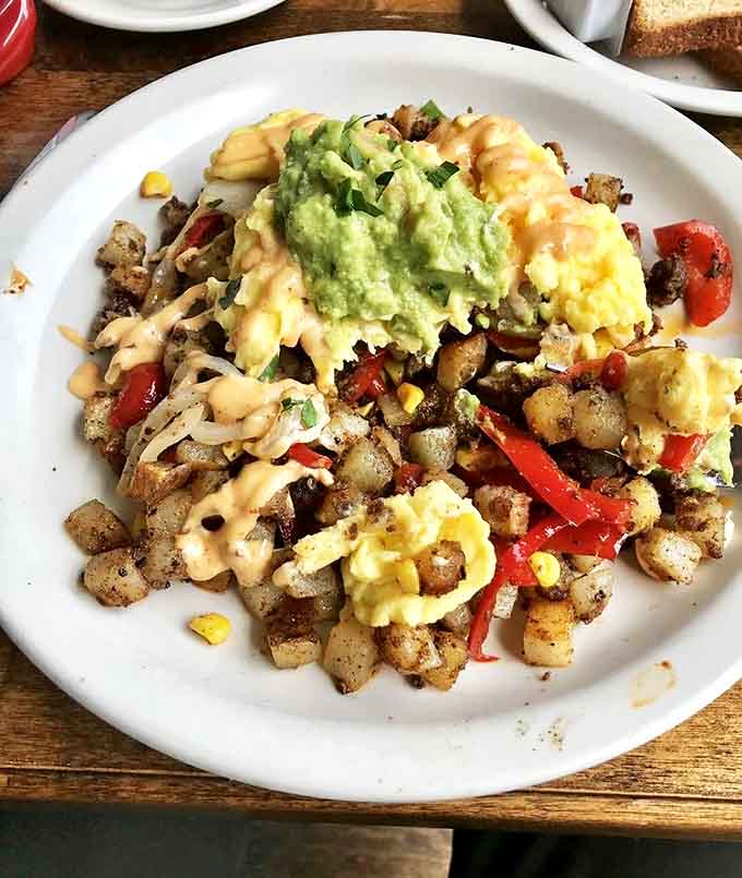 Behold the famous chorizo hash &ndash; a symphony of crispy potatoes, savory sausage, and colorful vegetables that'll haunt your breakfast dreams.