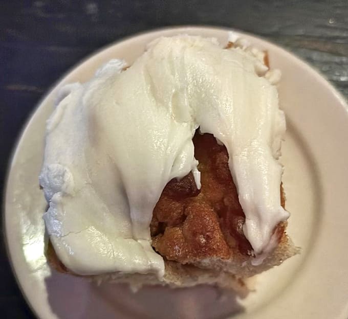 This isn't just dessert &ndash; it's a religious experience. Kelly's legendary cinnamon roll arrives warm with cream cheese frosting cascading down its spiraled perfection.